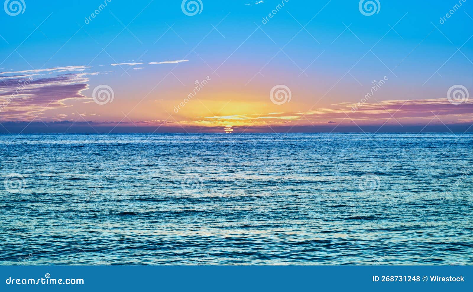 Sunset on the Beach and the Sun is Setting on the Horizon Stock Photo ...