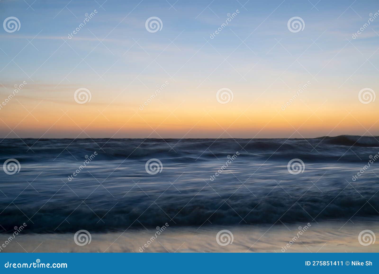 Sunset in a beach stock image. Image of surf, sunlight - 275851411