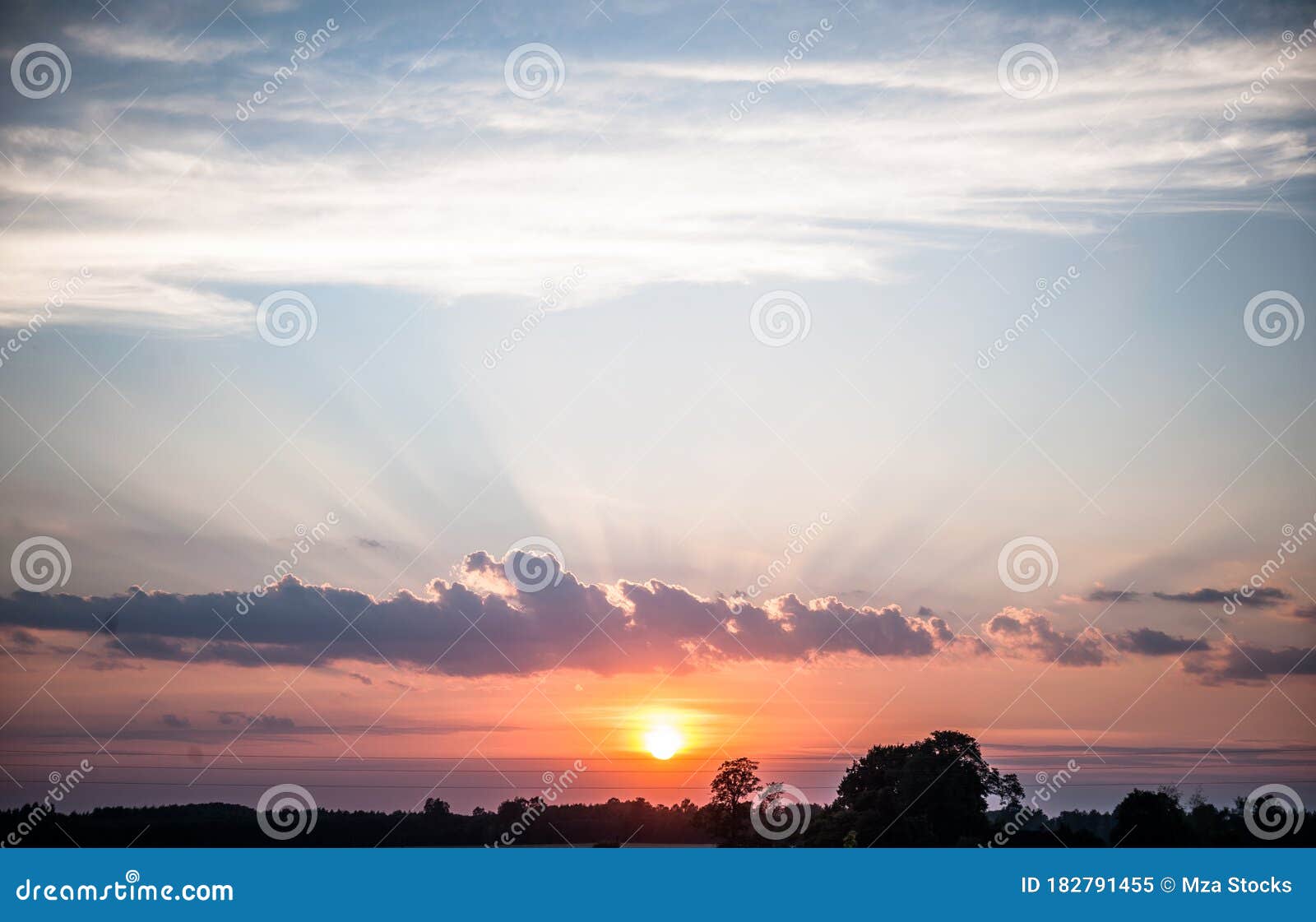 Sunset with Beautiful Cloudy Sky and Treeline Stock Image - Image of ...