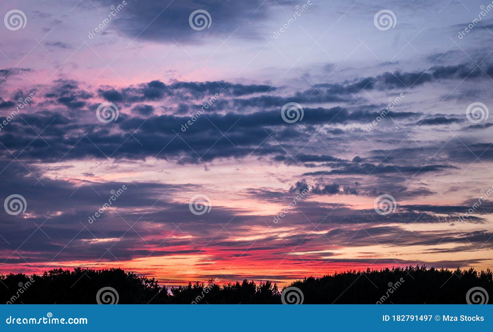 Sunset with Beautiful Cloudy Sky and Treeline Stock Image - Image of ...
