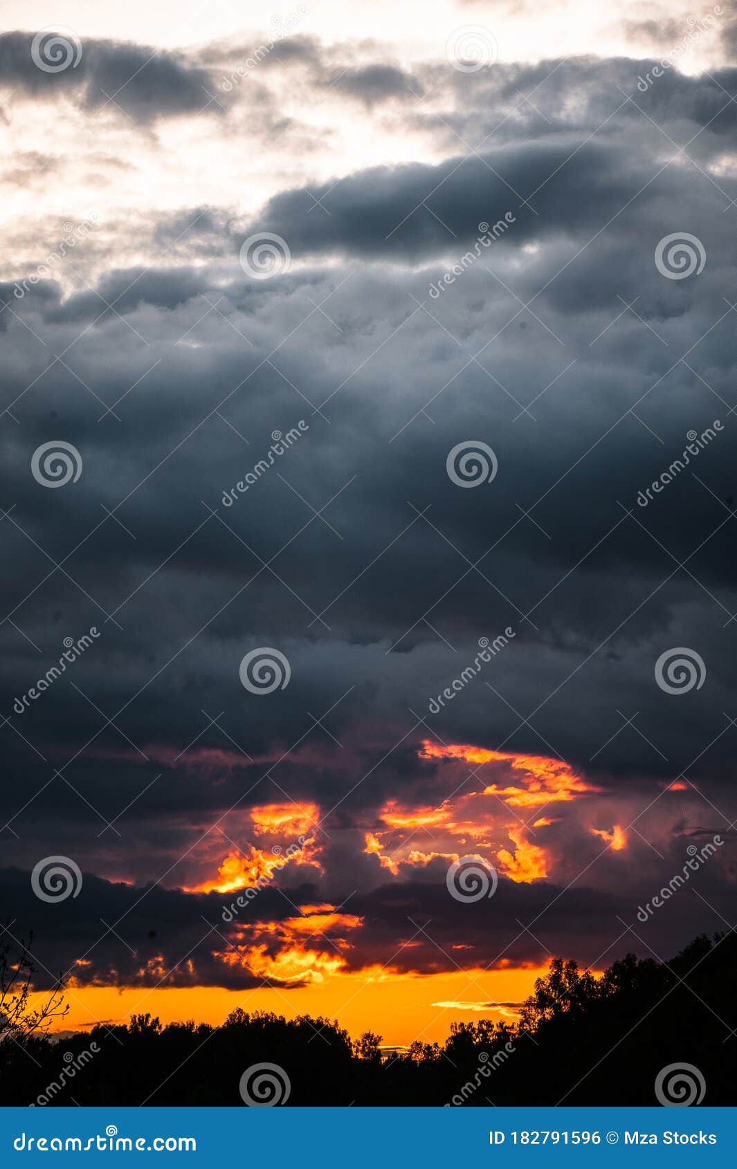 Sunset with Beautiful Cloudy Sky and Treeline Stock Photo - Image of ...