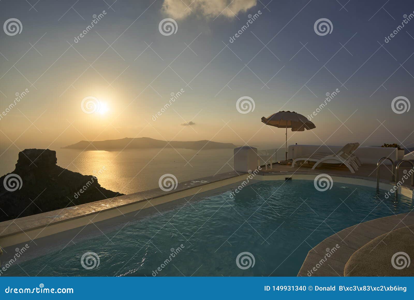 Sunset at a Beautiful Infinity Pool in Santorini, Greece Stock Photo ...