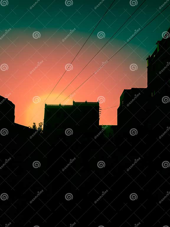 Sunset behind the building stock photo. Image of sunset - 251308554