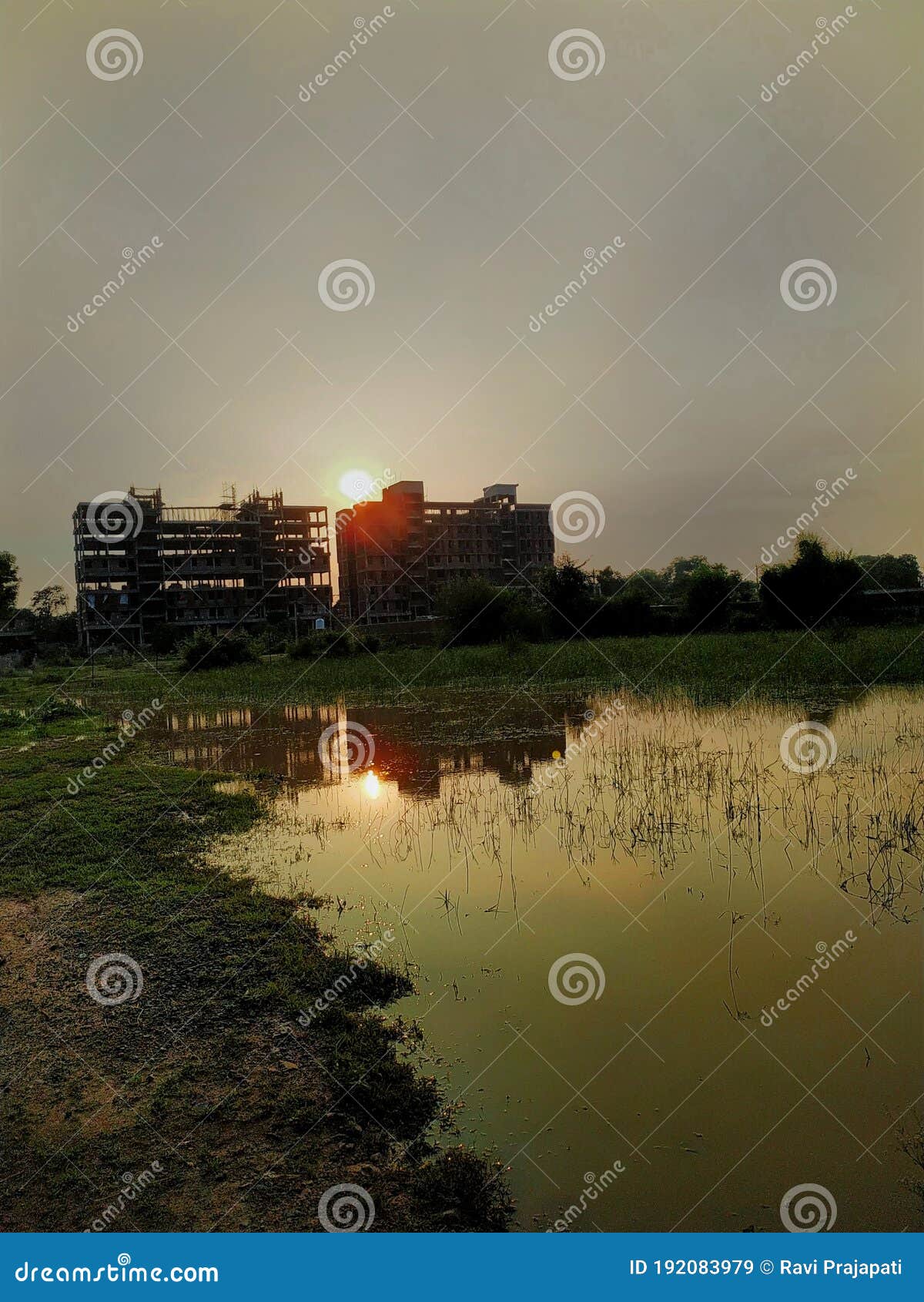 Sunset Behind the Building and Its Reflect Stock Image - Image of land ...