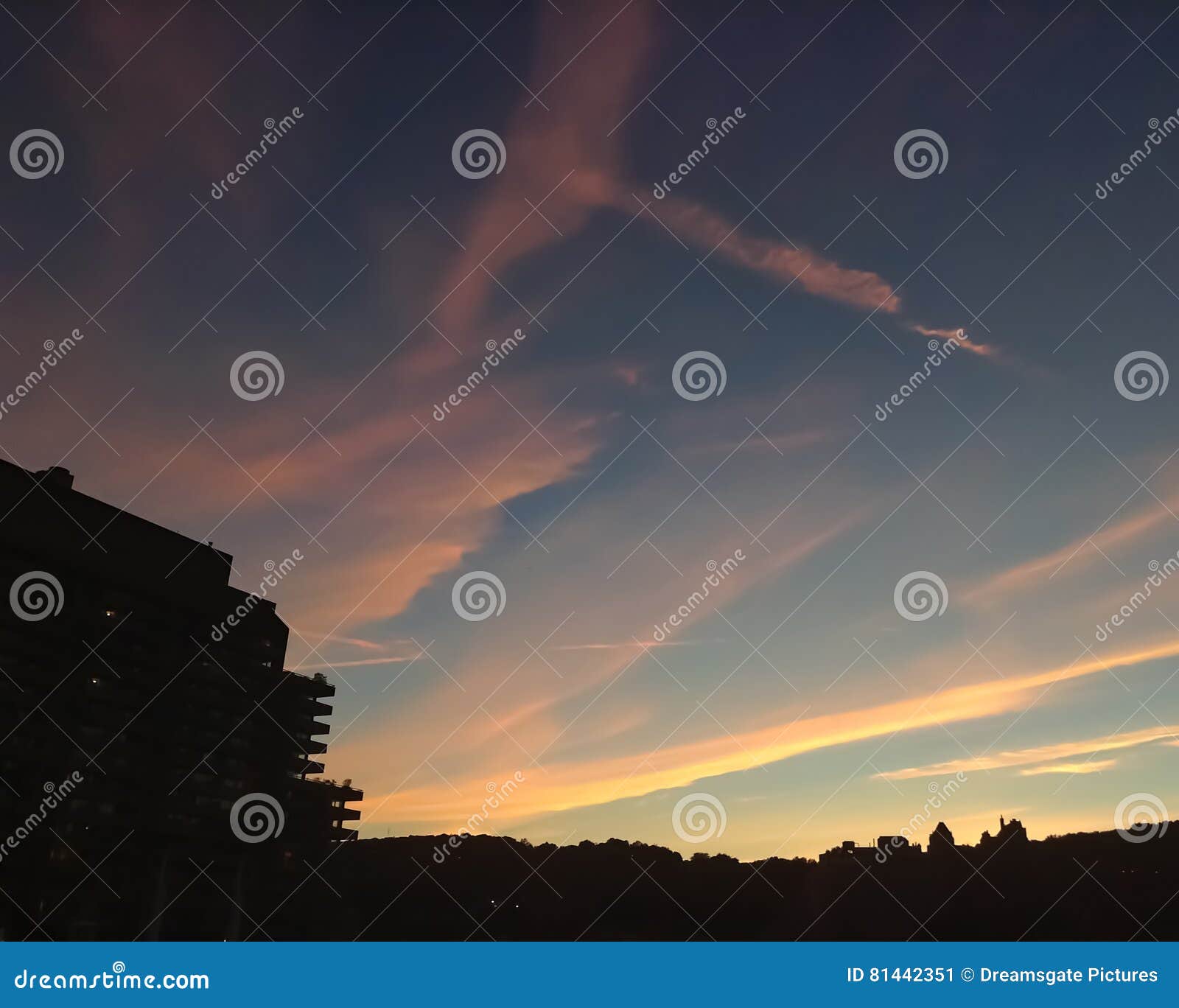 Sunset behind buildings stock image. Image of buildings - 81442351