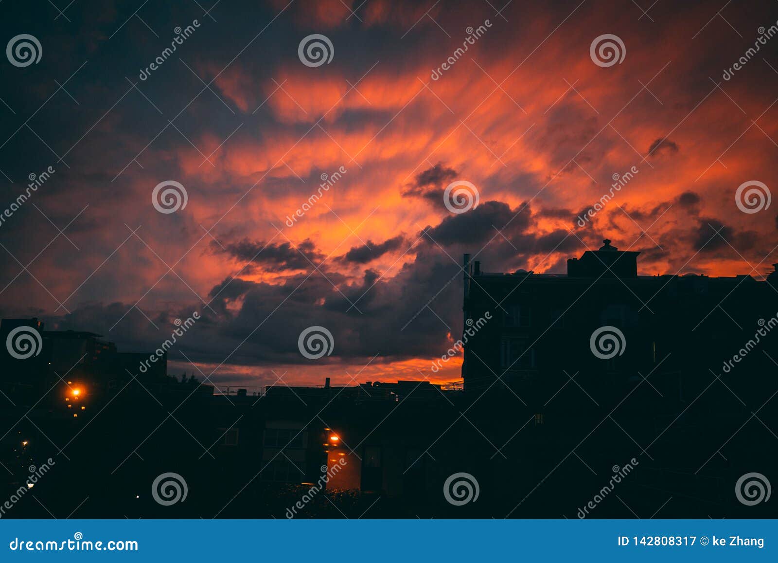 Sunset Behind Buildings with Red Light Stock Image - Image of rays ...