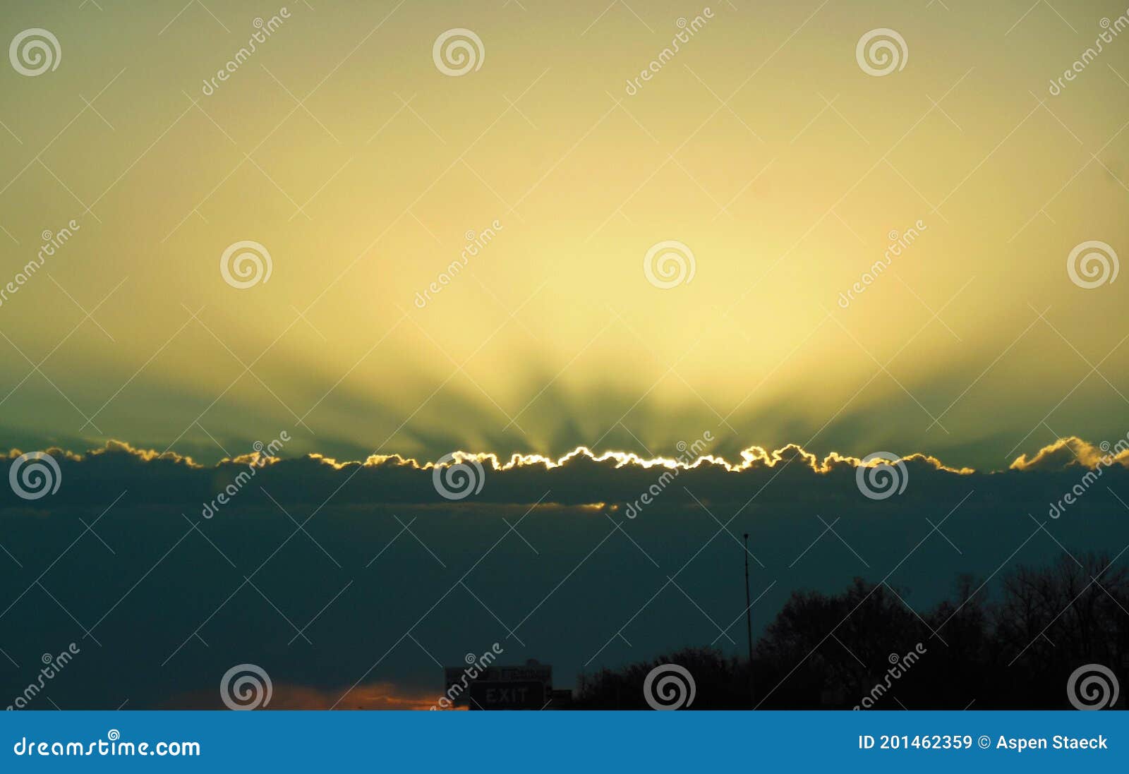 Sunset Behind Clouds Casting Shadows Stock Image - Image of light ...