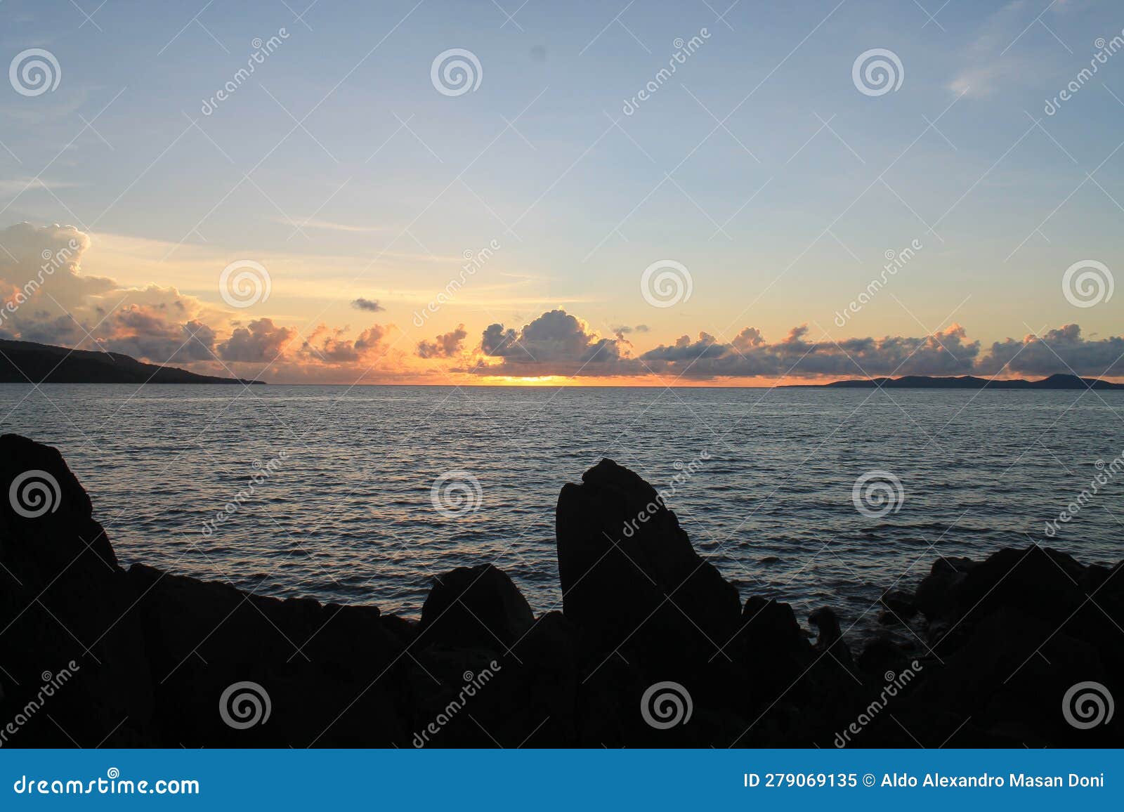 Sunset from Behind the Clouds with Views of the Sea and Beautiful Rocky Beaches Stock Image ...