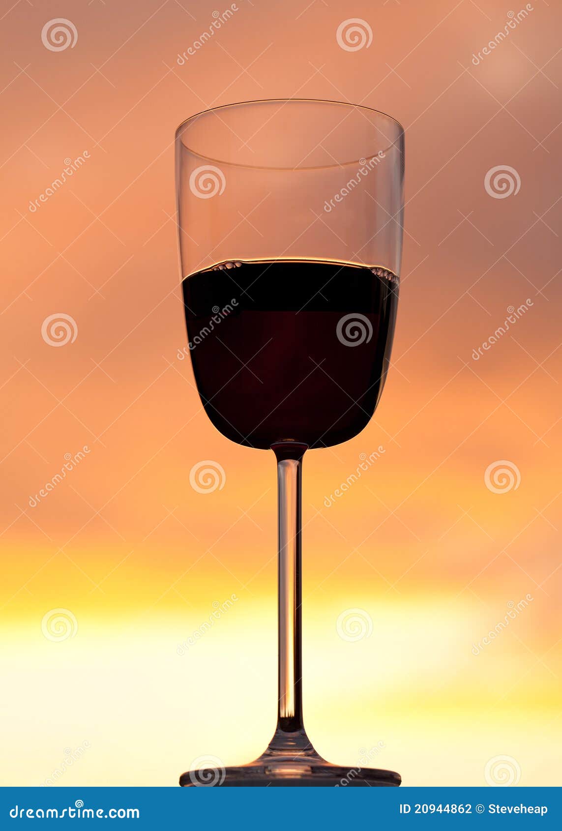 Sunset Behind Glass of Red Wine Stock Photo - Image of sundown ...