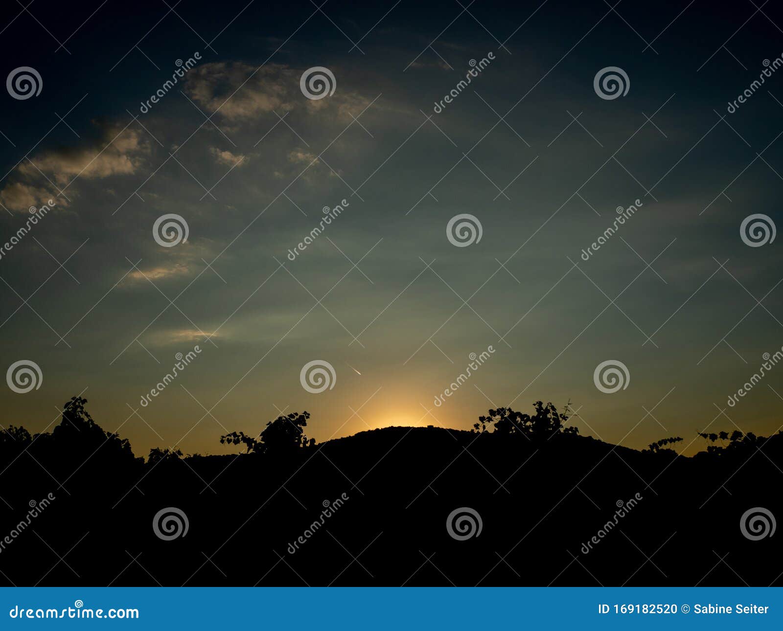 Sunset Behind Hills and Bushes Stock Photo - Image of rural, bushes ...