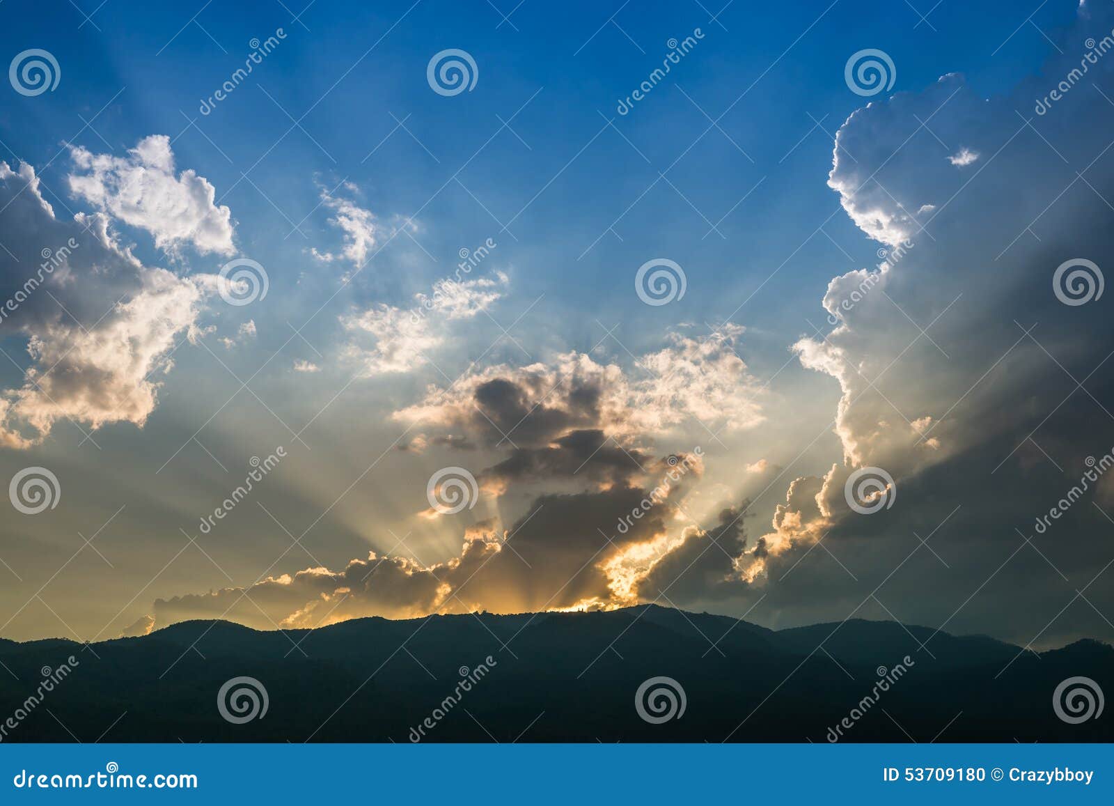 Sunset Behind Mountain with Beautiful Sunbeam through the Cloud Stock ...
