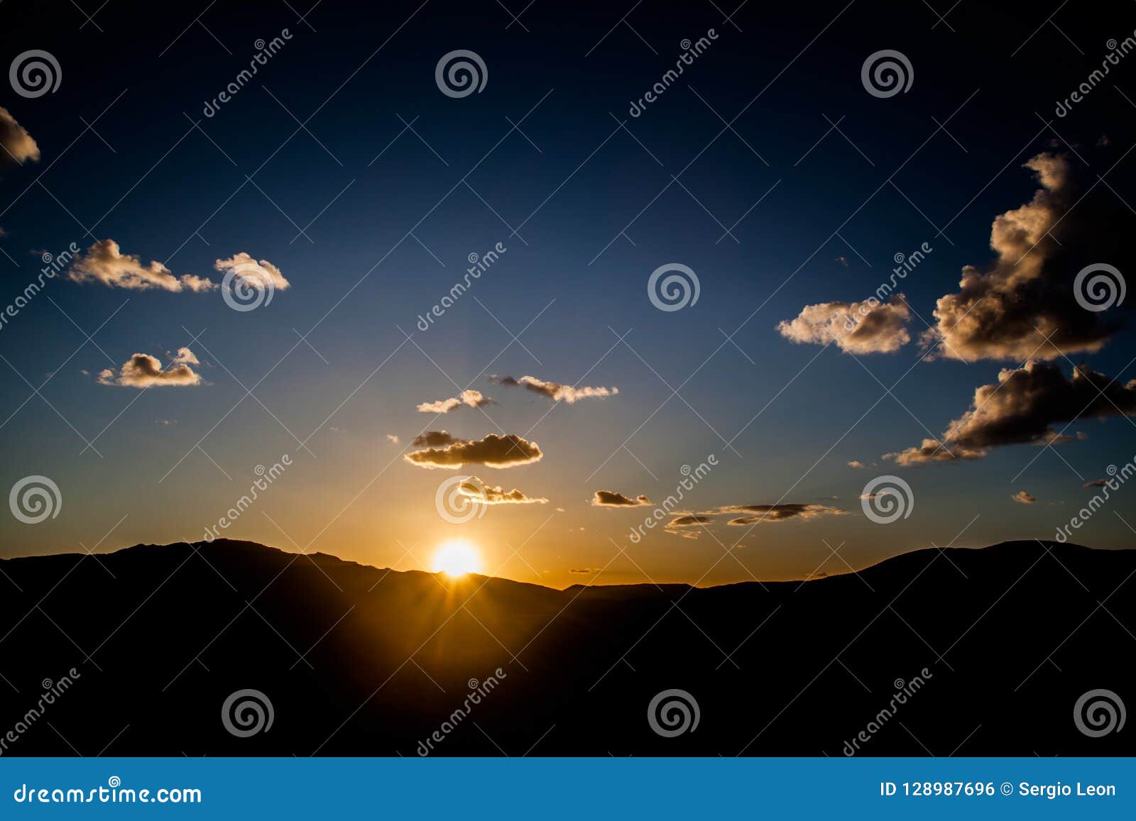 Sunset Behind the Mountains Stock Photo - Image of dramatic, bright ...