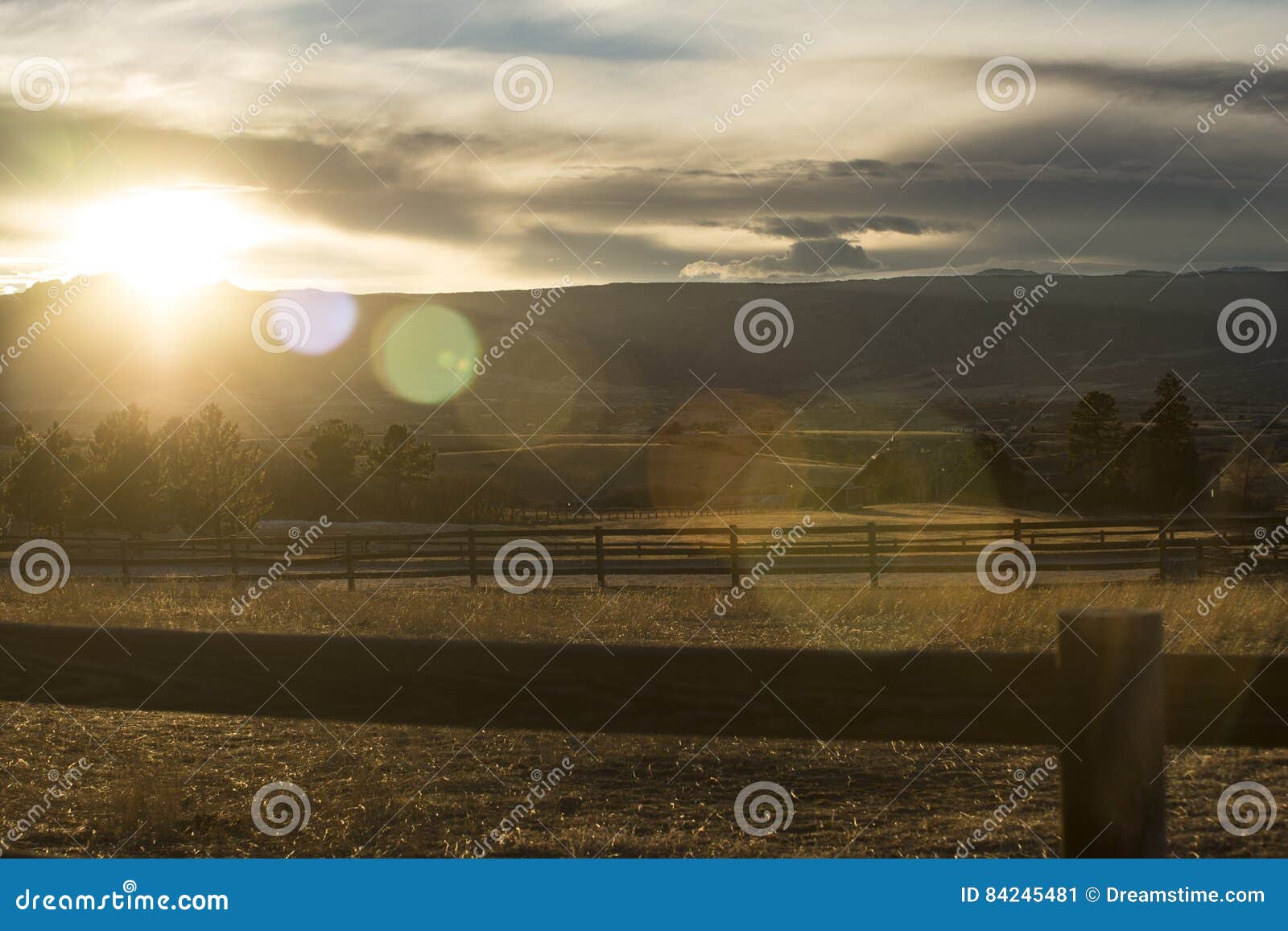 Sunset Behind the Mountains Stock Image - Image of overlooking, fences ...