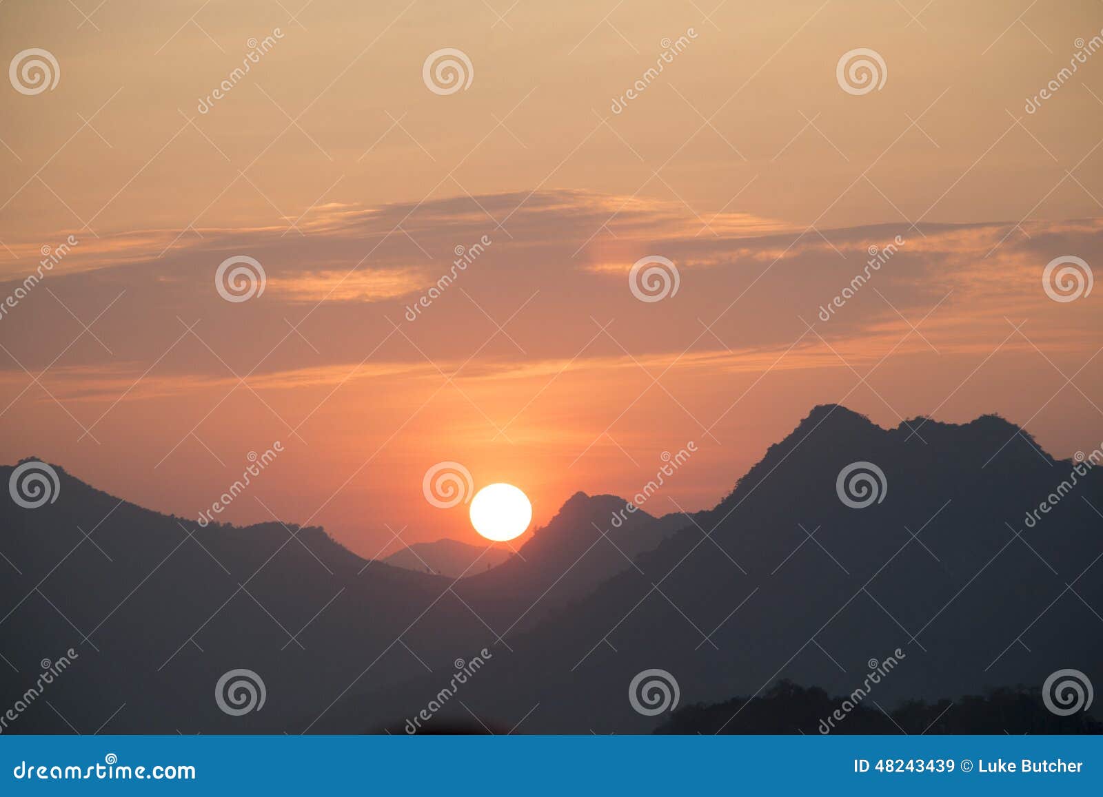 Sunset Dipping Behind Mountains Stock Image - Image of blue, light ...