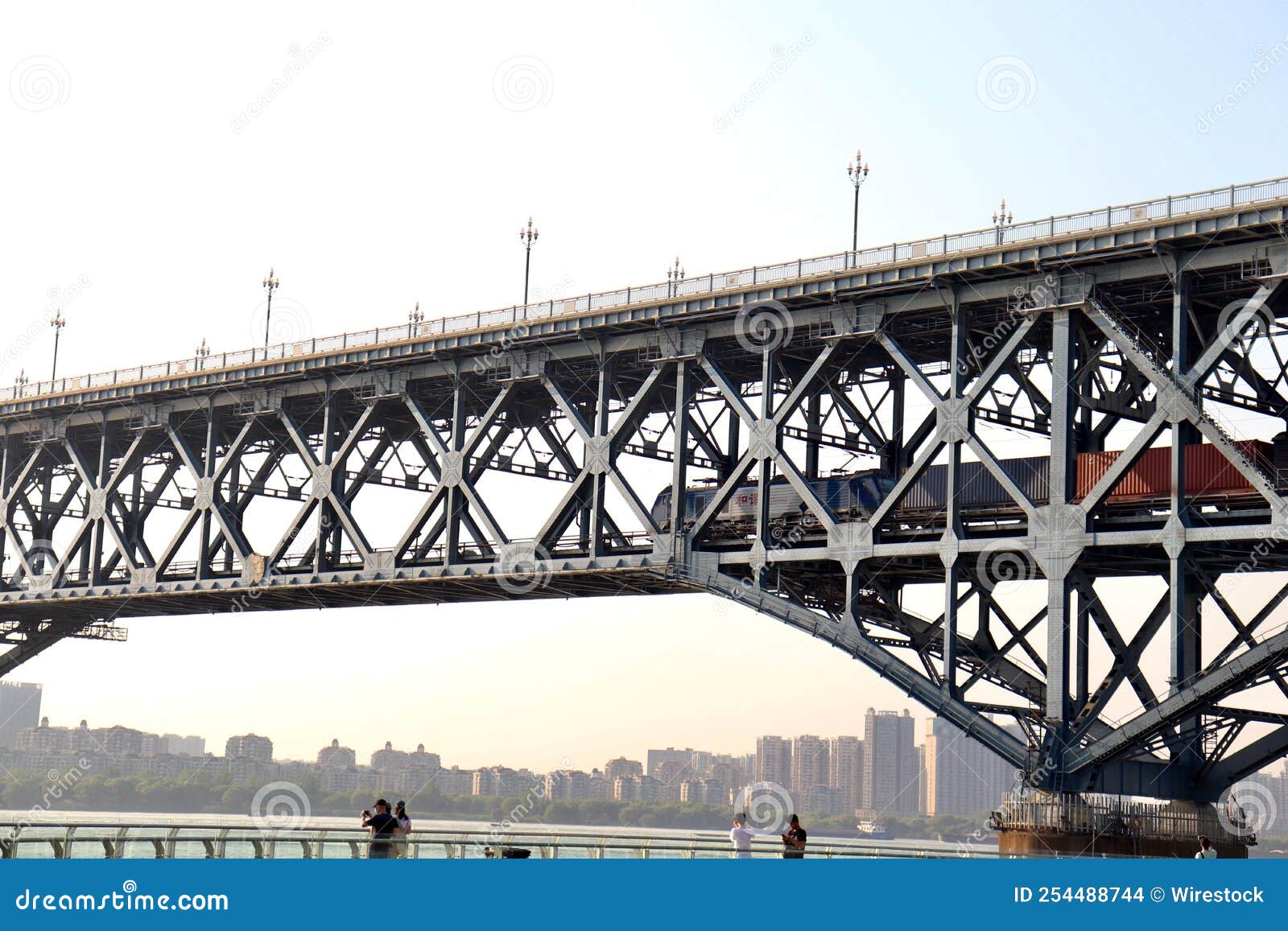 Sunset Behind Nanjing Yangtze River Bridge with a Train Passing through ...