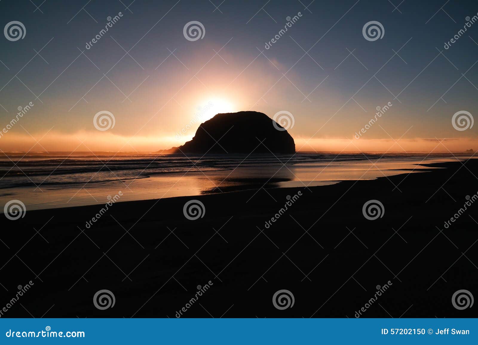 Sunset behind the rock stock photo. Image of sand, oregon - 57202150