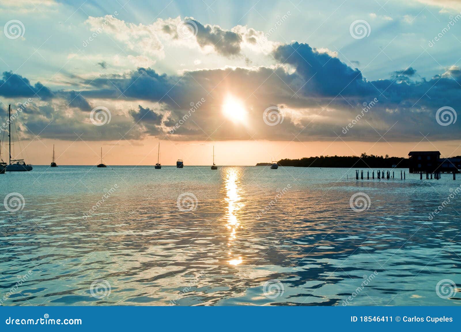 Sunset behind sailboats stock image. Image of travel - 18546411
