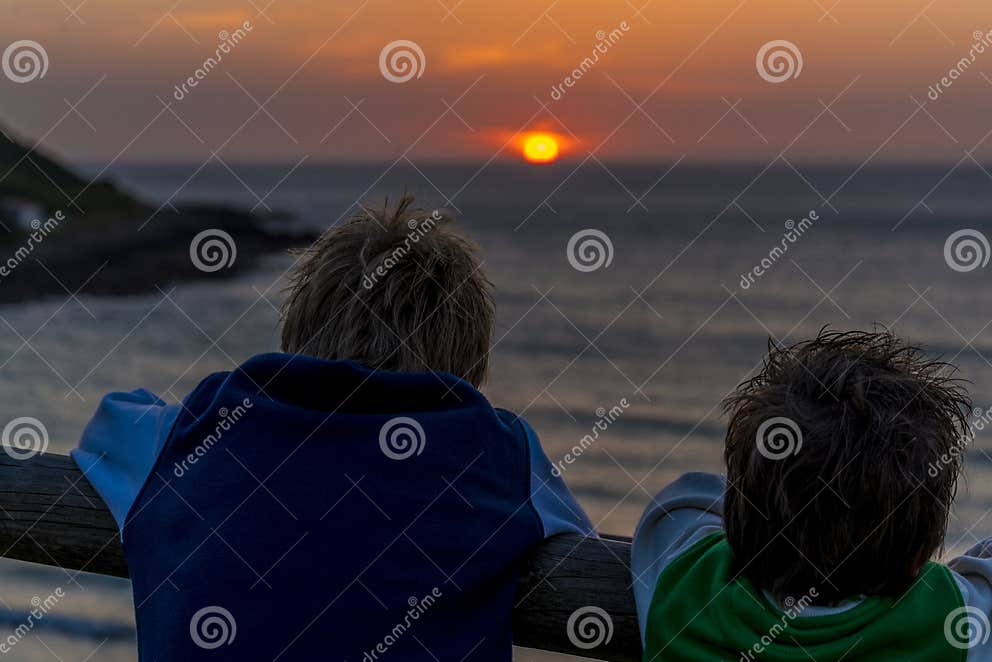 Sunset boys stock image. Image of back, persons, vacation - 32641607