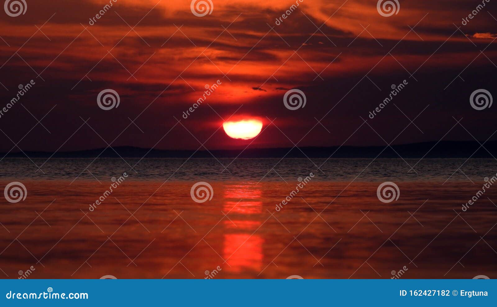Sunset of a Bright Red Sun and Dark Red Sky Stock Photo - Image of ...