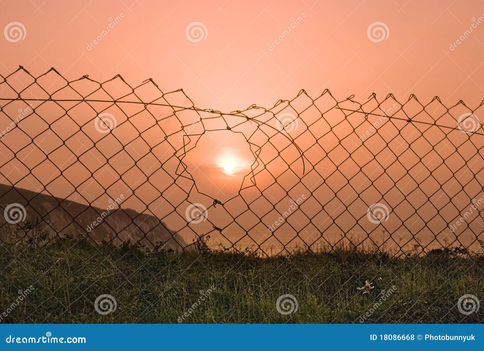 Sunset through a Broken Wire Fence. Stock Photo - Image of calm, serene ...