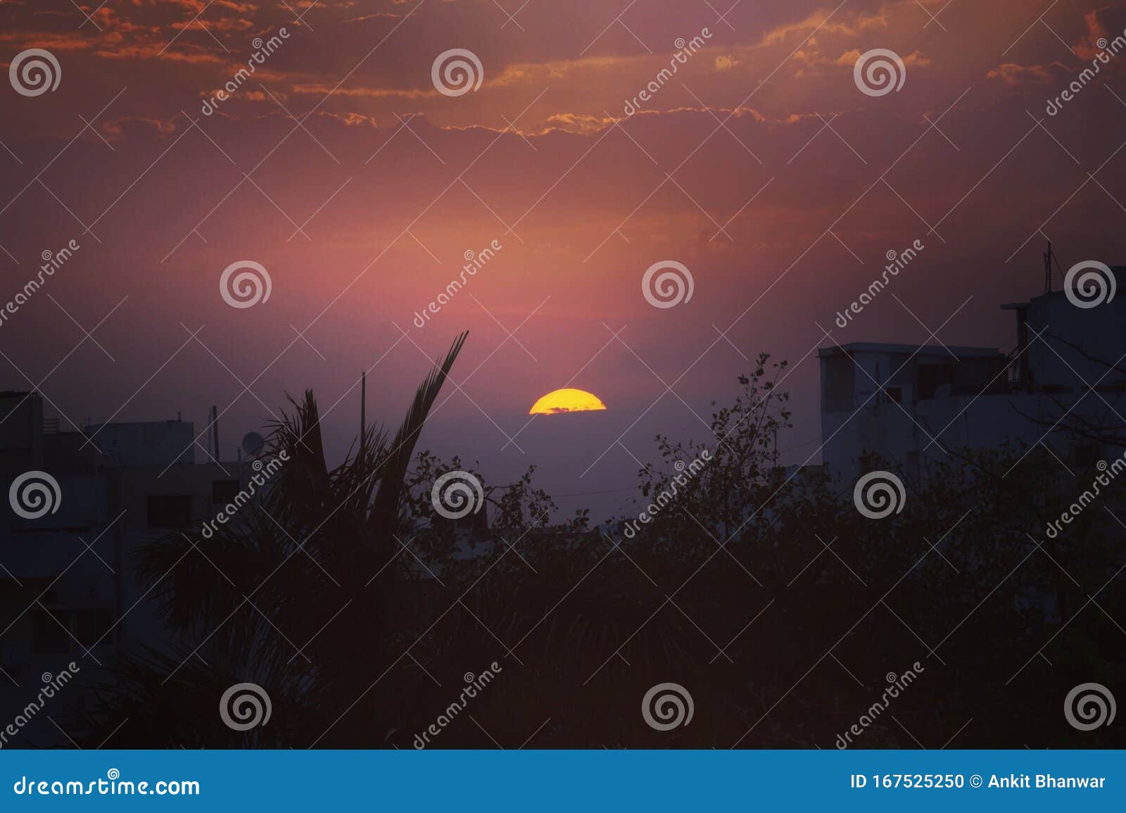 Sunset Captured with Crescent Sun in the Sky Stock Photo - Image of ...
