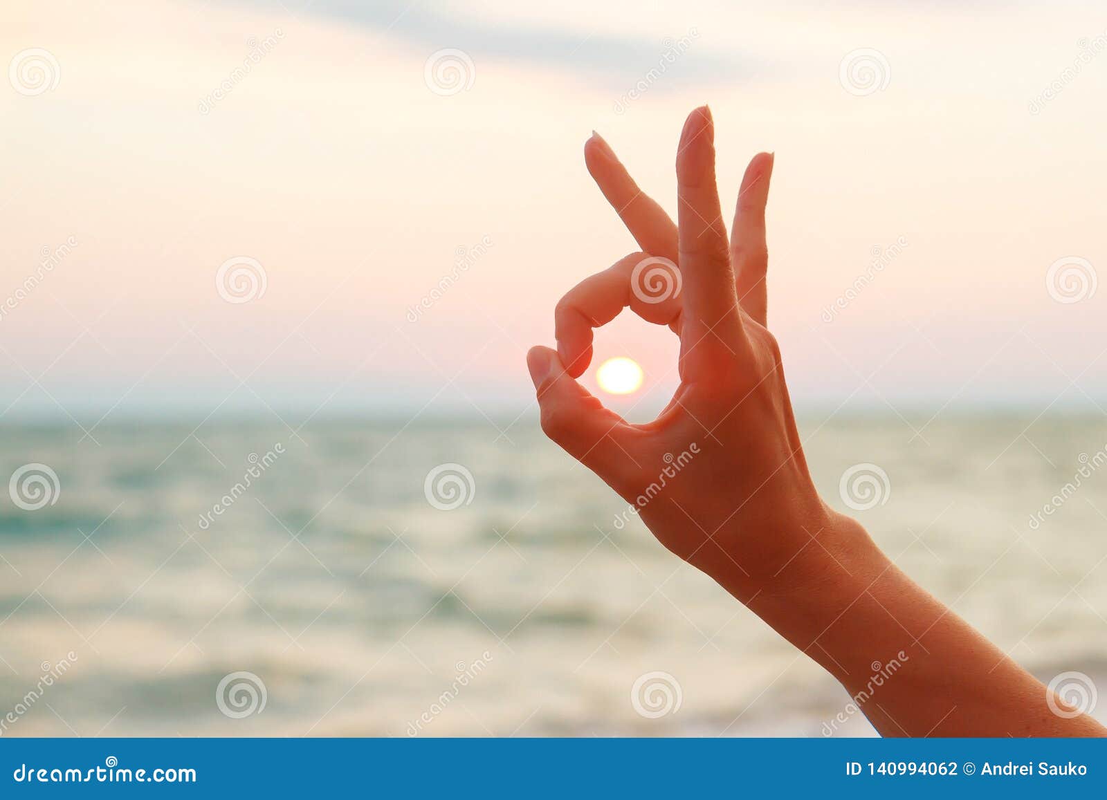 Sunset Captured by Hand Under the OK Sign Stock Photo - Image of sign ...