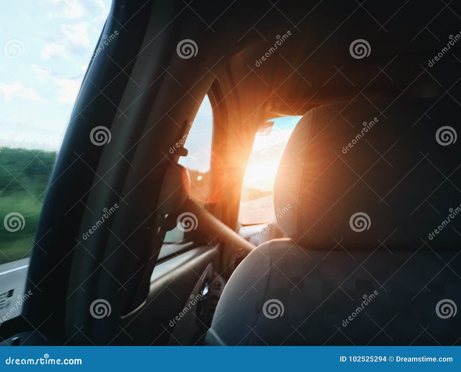 Sunset in the car stock photo. Image of looking, driving - 102525294