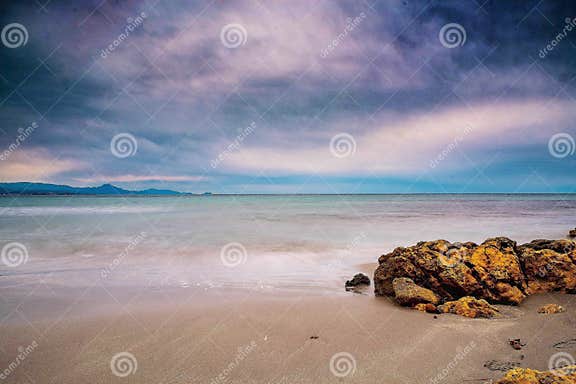 Sunset at carabassi beach stock photo. Image of sand - 180894766