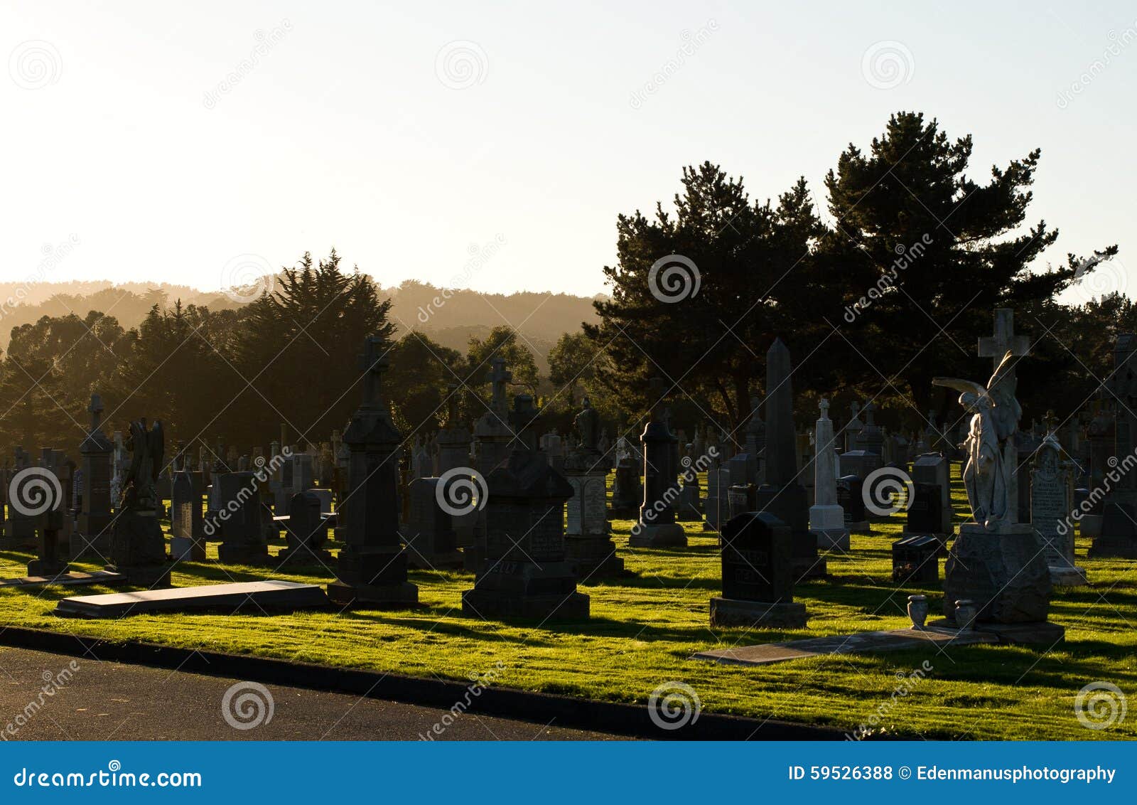 Sunset at the Cemetery stock photo. Image of hill, interred - 59526388