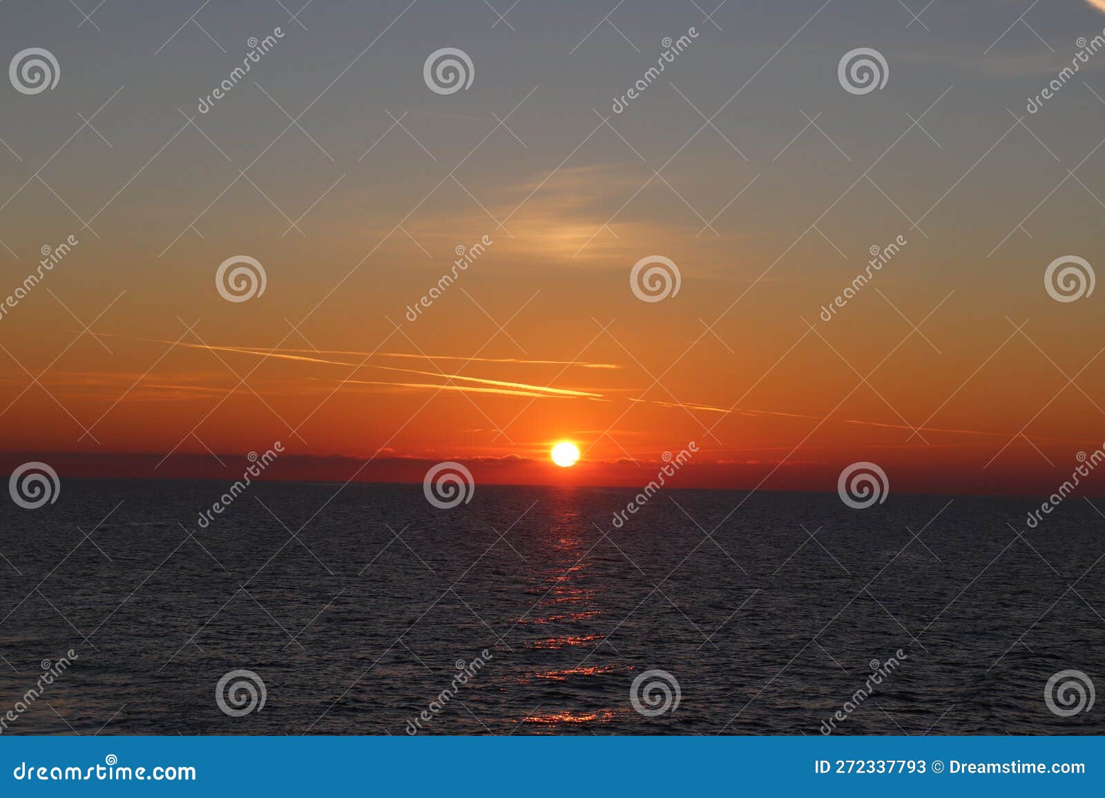 Sunset on Cloudless Sky and Calm Sea Surface in the Background Stock ...