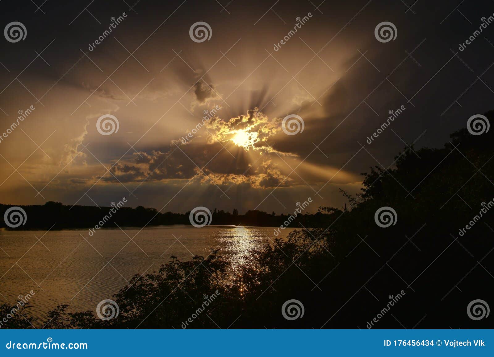 Sunset with Clouds, Light Rays and Other Atmospheric Effect Stock Photo ...