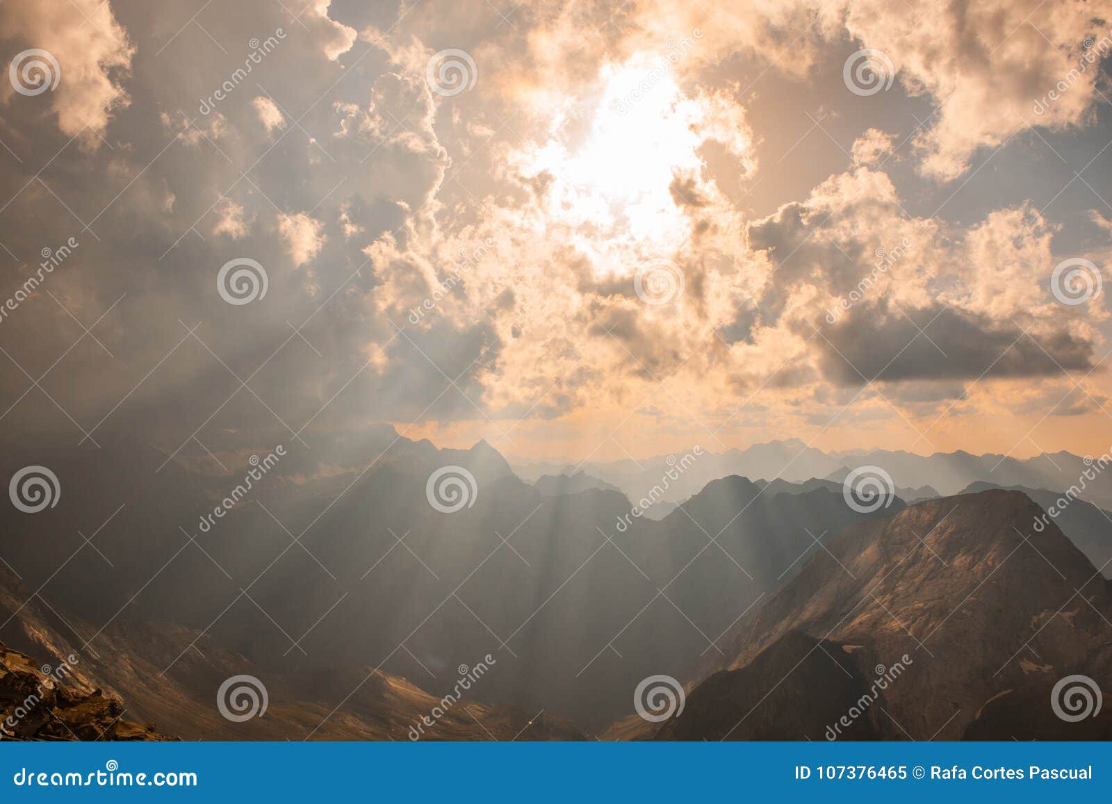 Sunset between Clouds and Mountains. Dramatic Mountain Scenary Stock ...