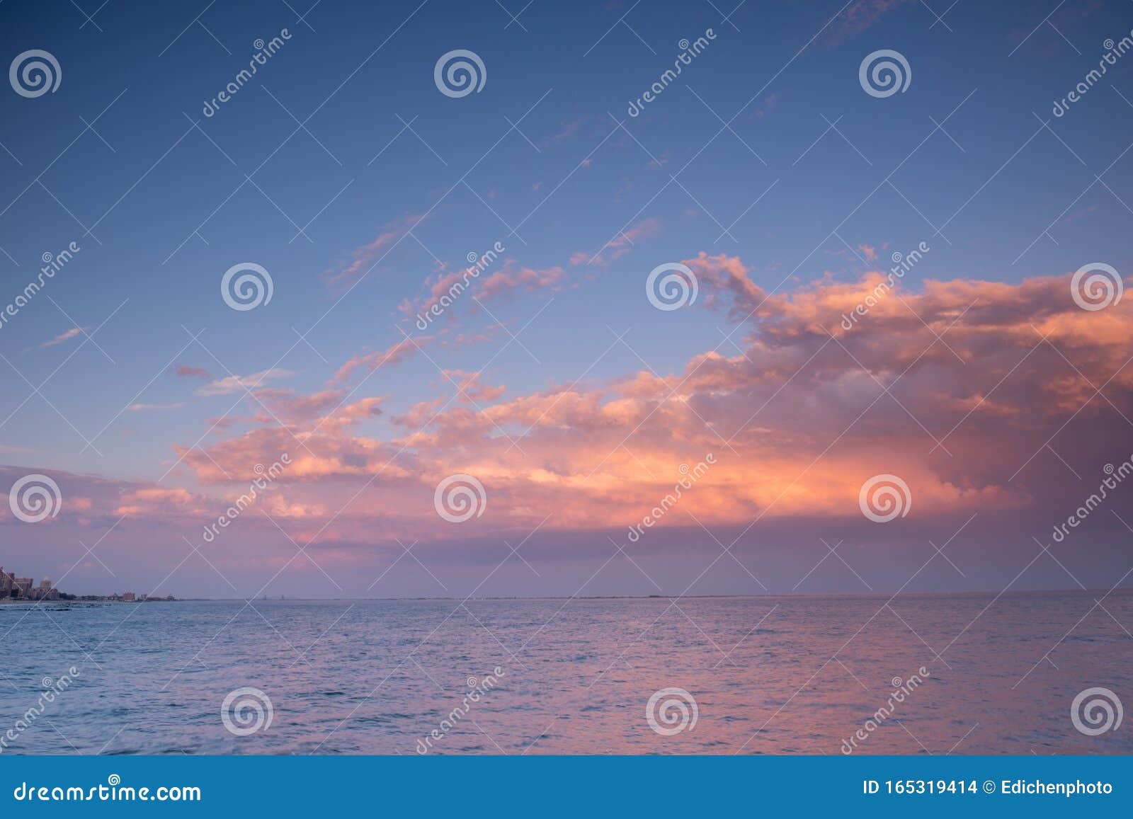 Sunset Clouds with Pink Light and Blue Sky in Coney Island New York ...
