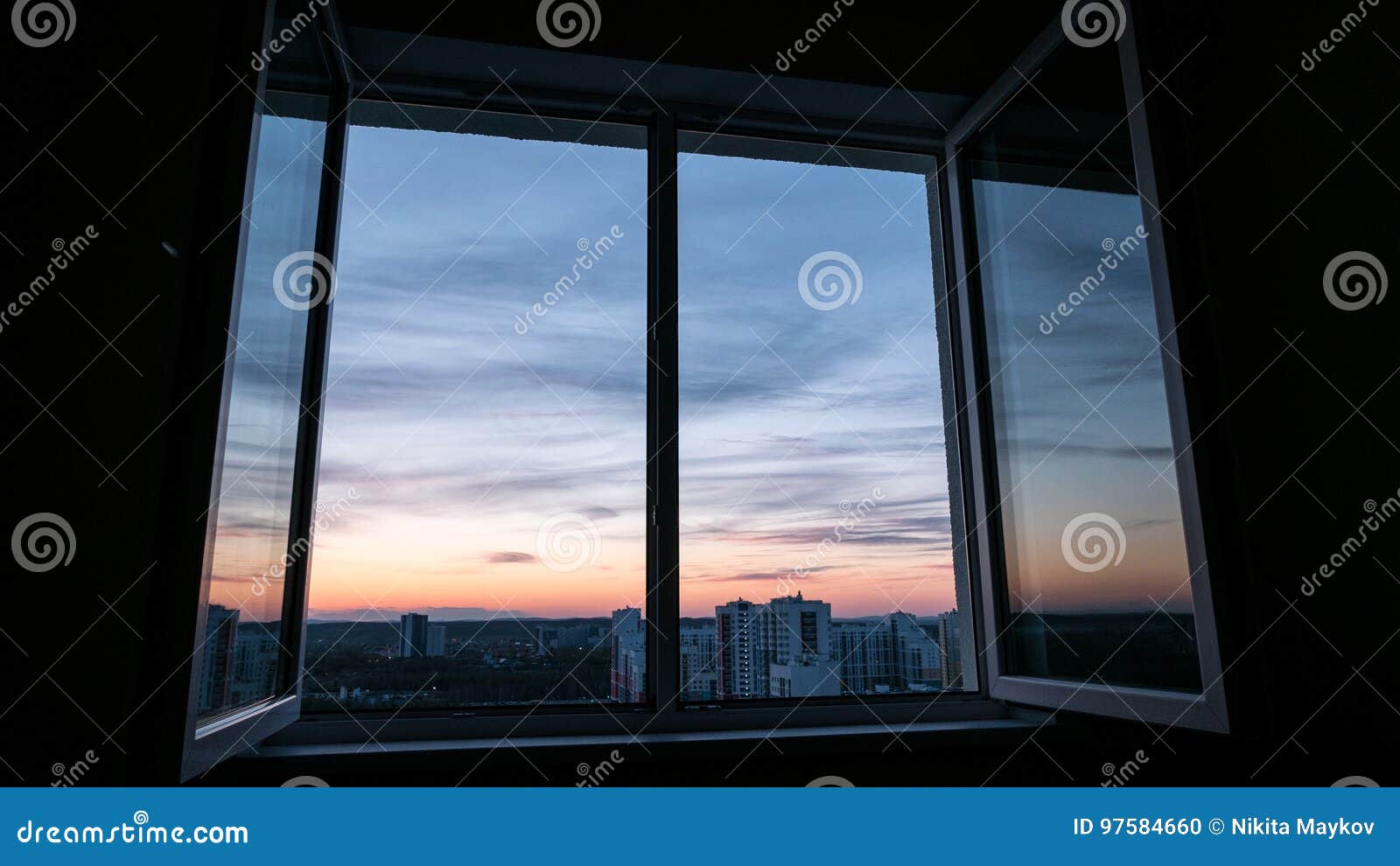 Sunset Clouds through a Window with a Reflection in the Window Casement ...