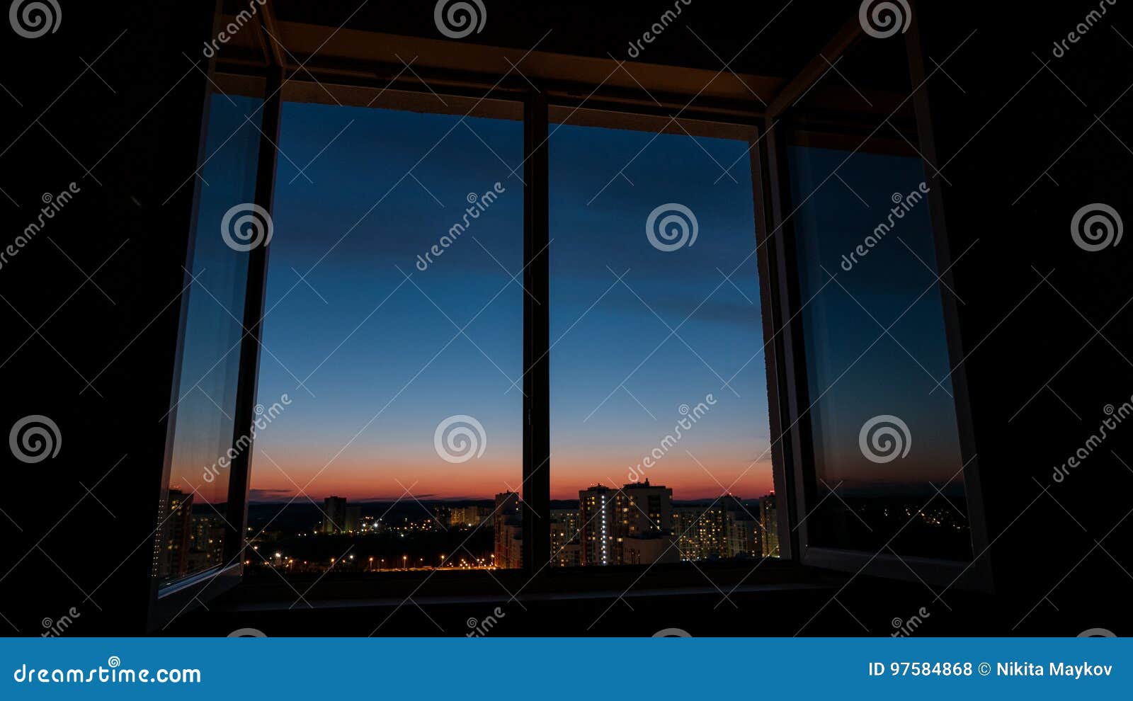 Sunset Clouds through a Window with a Reflection in the Window Casement ...