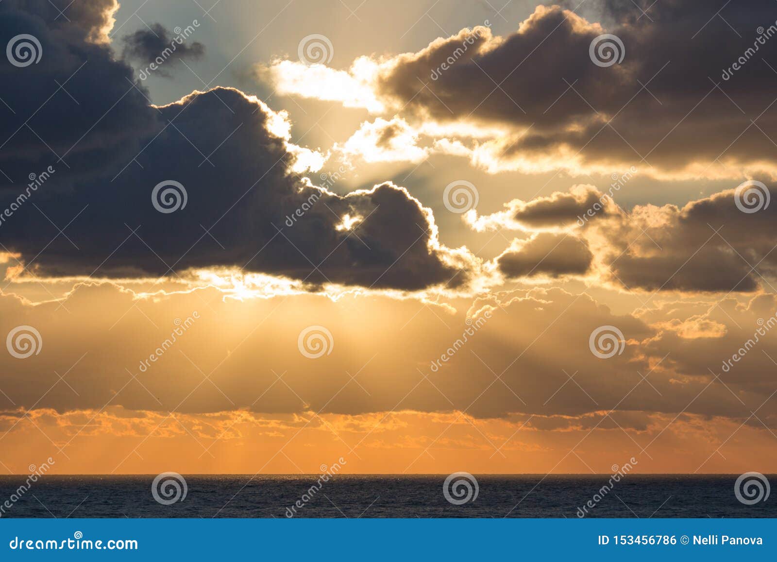 The Sunset from a Cloudy Evening Sky Stock Photo - Image of beam ...