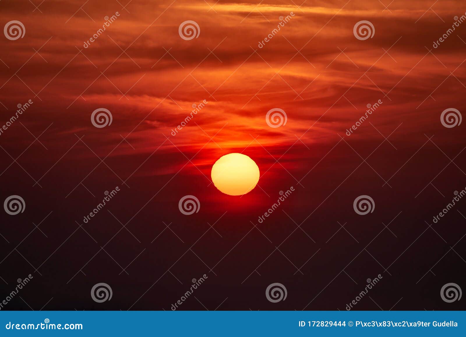 Sunset through Cloudy Red Sky Stock Photo - Image of distance, fantasy ...