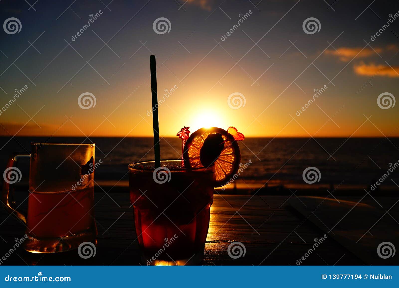 Sunset with cocktail stock photo. Image of mojito, nature - 139777194