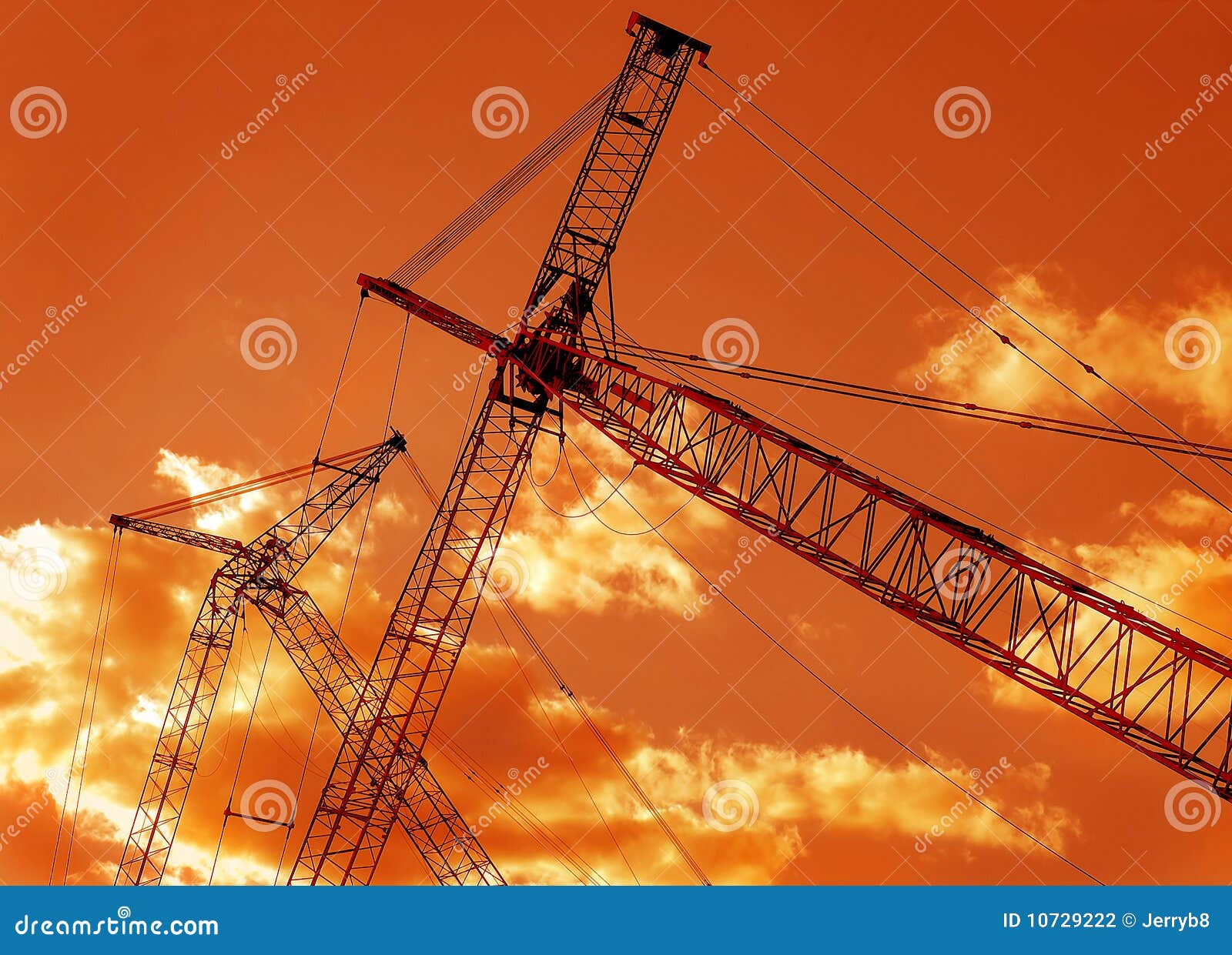 Sunset Crane Booms at Rest stock photo. Image of steel - 10729222