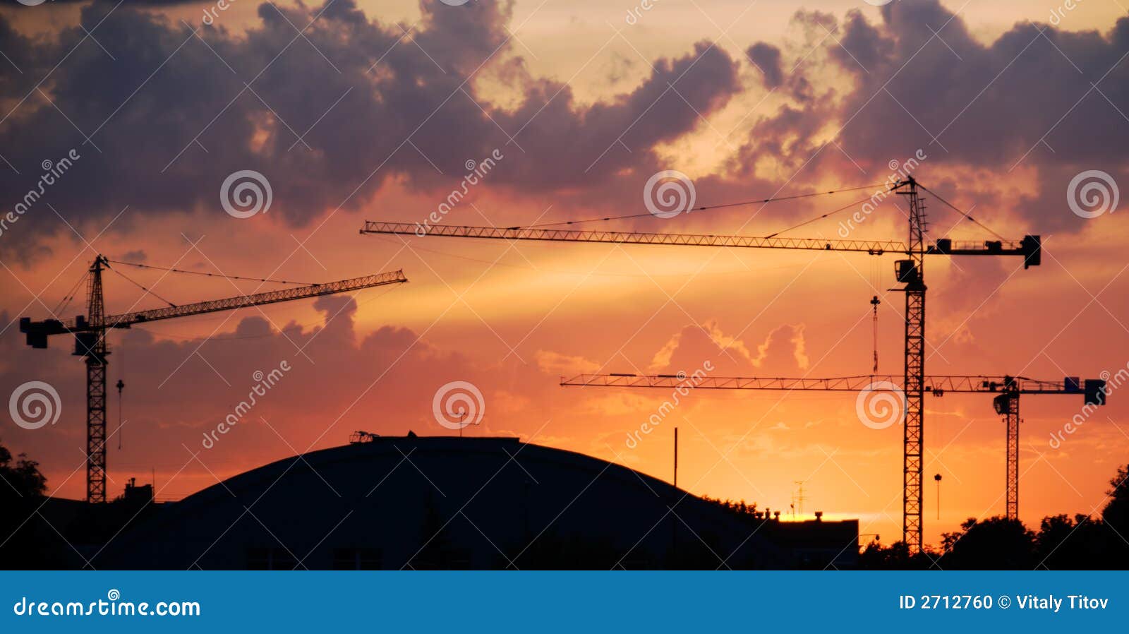 Sunset with Cranes stock photo. Image of development, exteriors - 2712760
