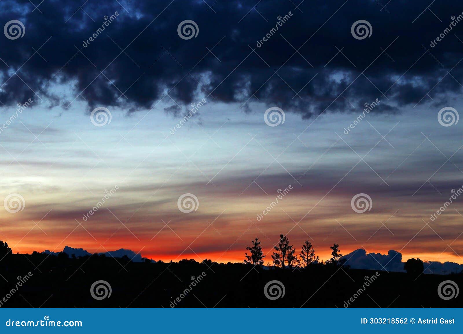 A Sunset with Dark, Eerie Rain Clouds Stock Photo - Image of ...