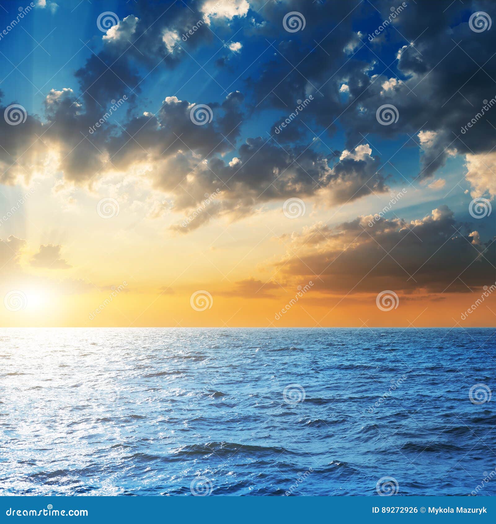 Sunset in Dark Sky Over Blue Sea Stock Photo - Image of dramatic, storm ...