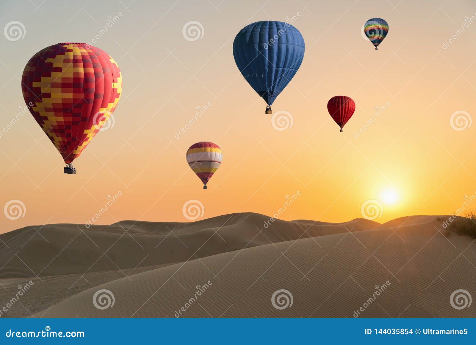 Sunset in Desert, Hot Air Balloons in Sky Stock Photo - Image of middle ...