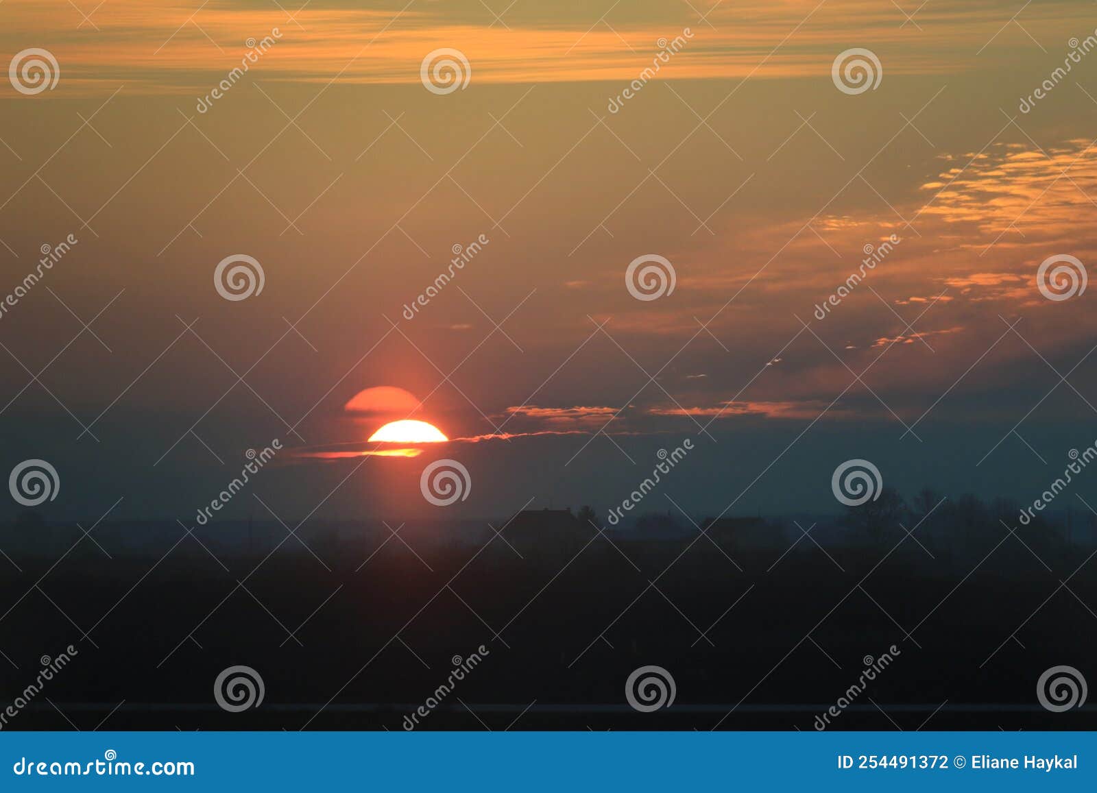 Sunset Double Sun stock photo. Image of glow, orange - 254491372