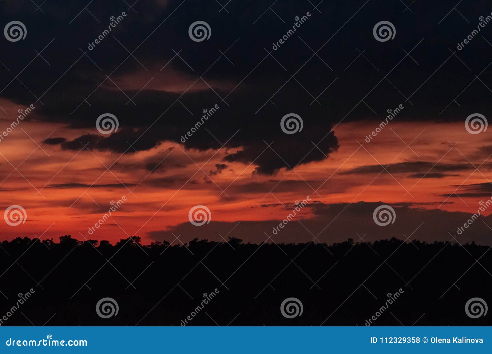 Sunset Dramatic Red Sky with Heavy Dark Blue Rainy Clouds Stock Photo ...