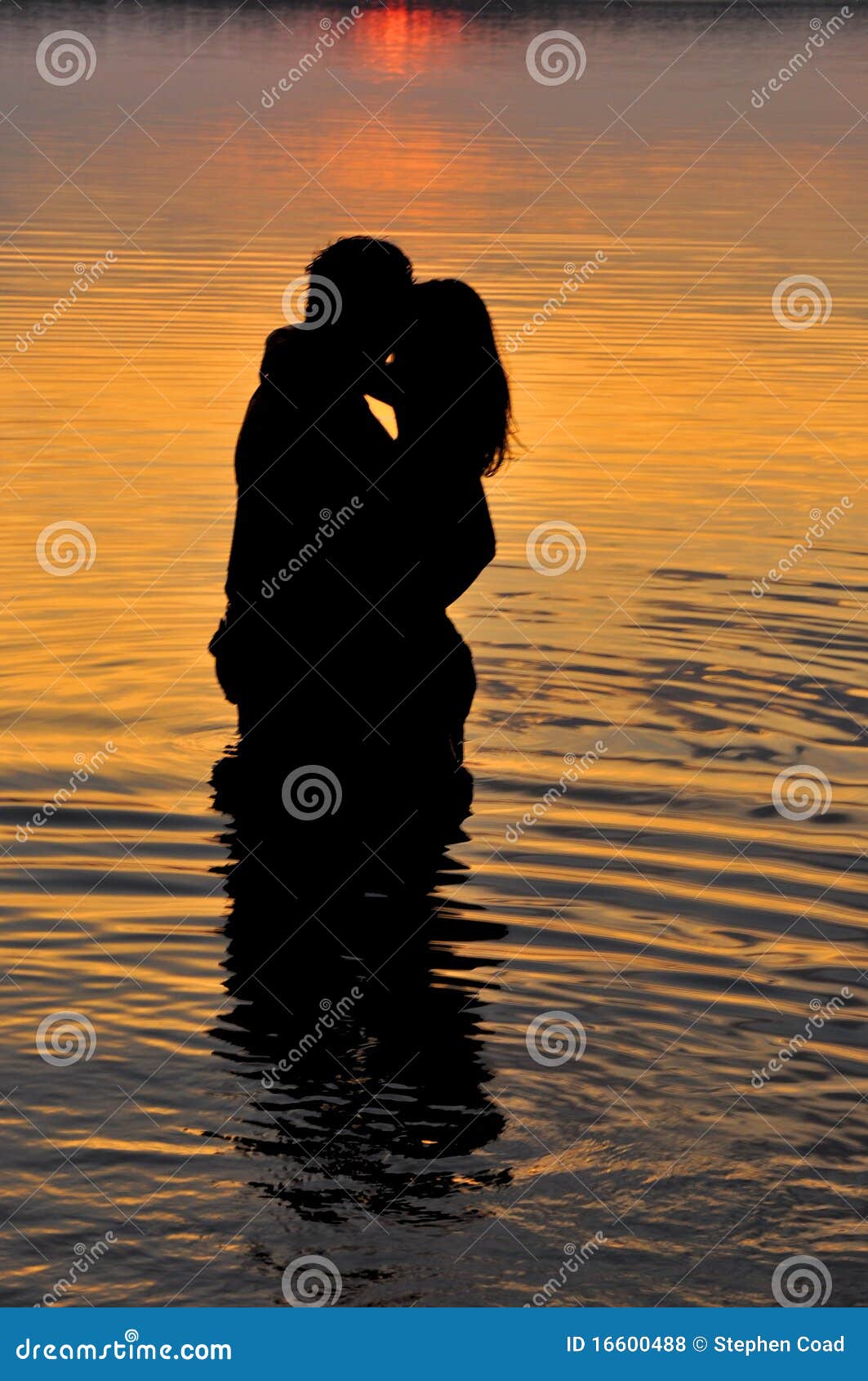 Sunset Embrace stock photo. Image of stream, kiss, quiet - 16600488