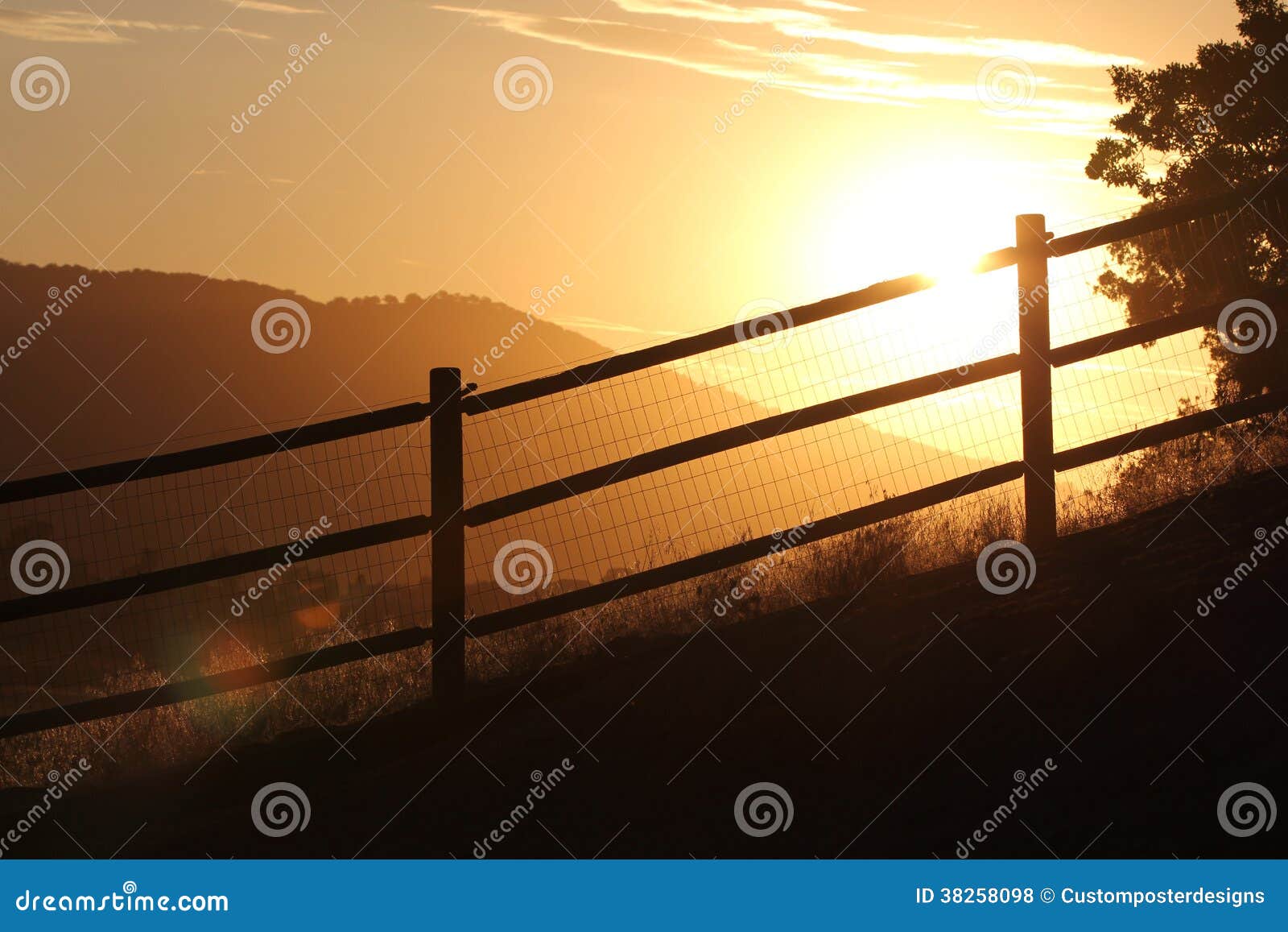 Sunset through a fence. stock photo. Image of country - 38258098