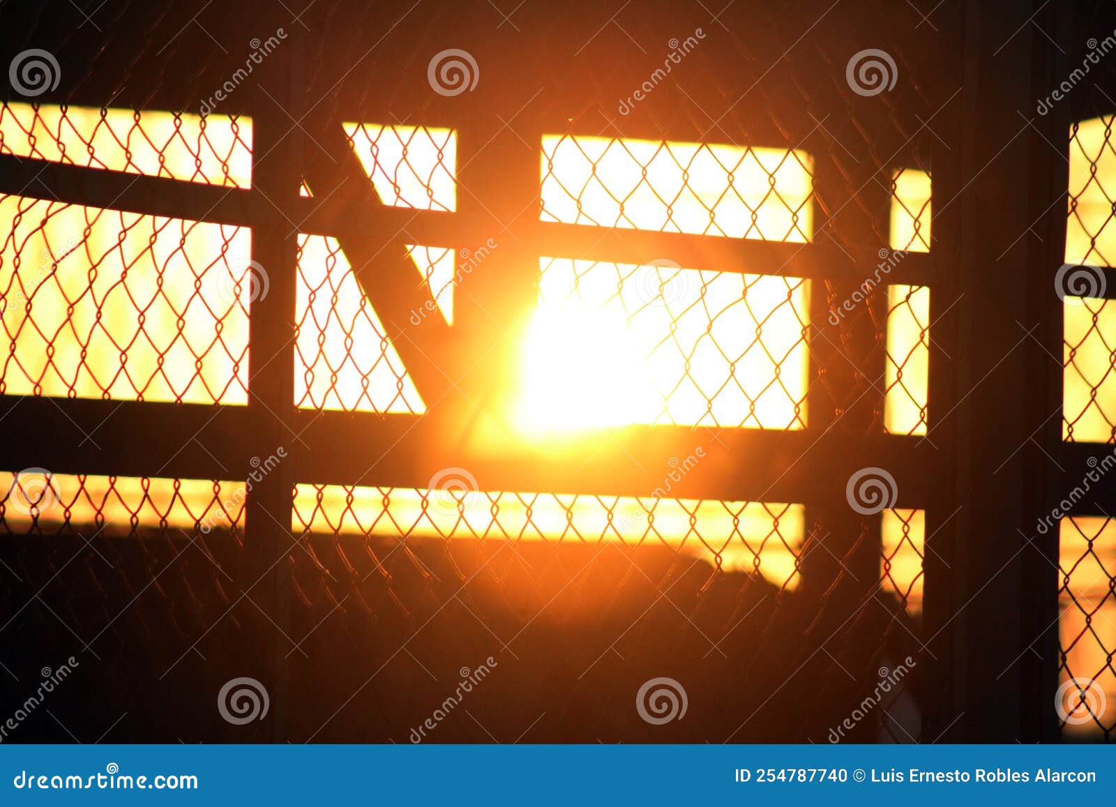 Sunset through a Fence in Construction Stock Photo - Image of color ...