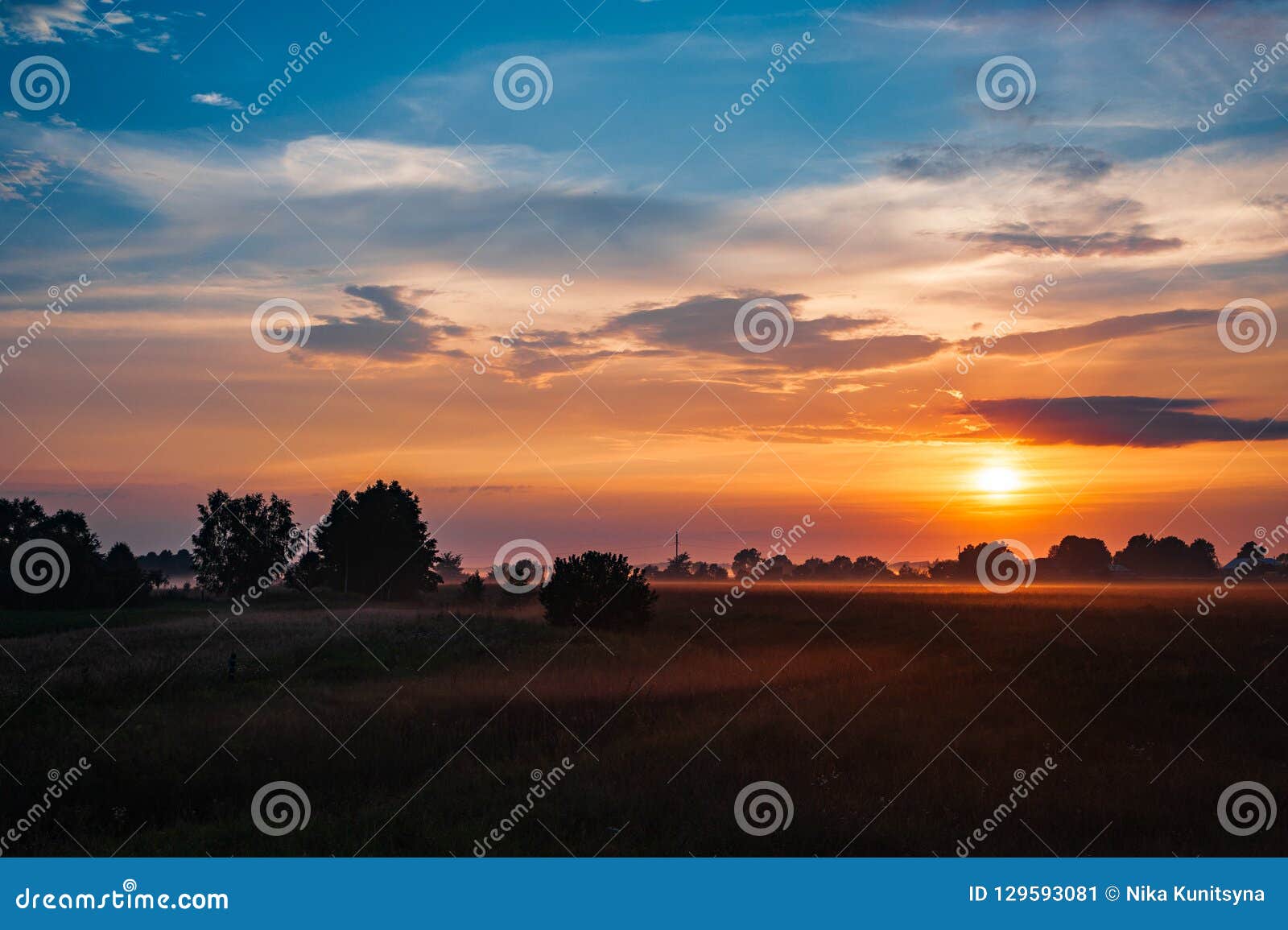 Sunset in the field stock image. Image of land, grass - 129593081