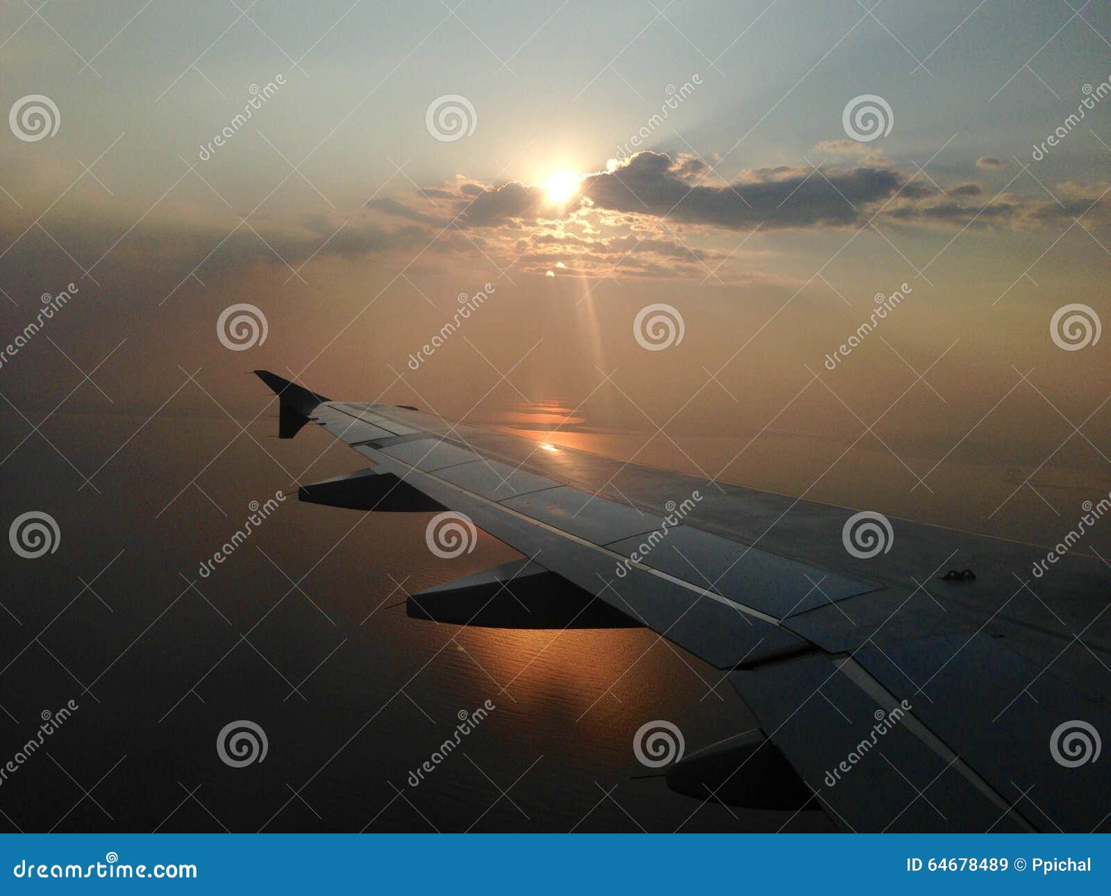 Sunset stock image. Image of sunset, wing, flight, clouds - 64678489